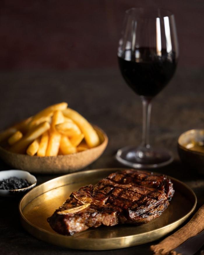 Steak Frites with wine at radii restaurant & bar